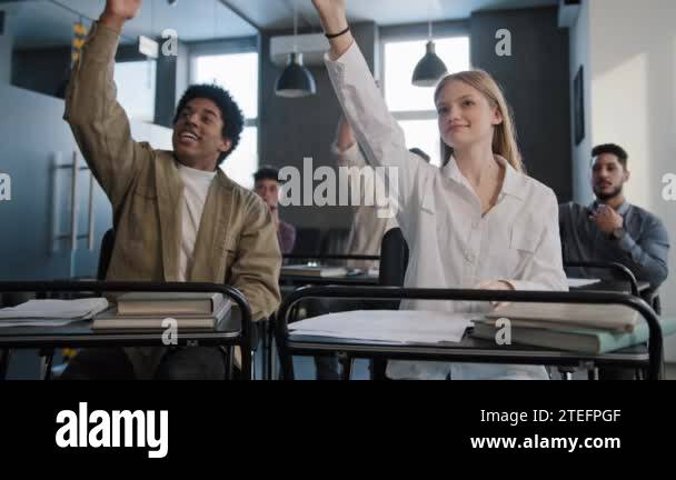 Diverse group smart students sitting in classroom at lesson carefully ...