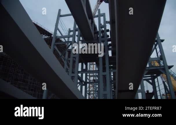 Parts of carcass made of metal beams at stadium construction site low ...