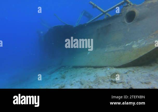 4K.Real old sunken ship wreck underwater at sea.Submerged boat in ocean ...