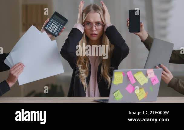 Sad overworked exhausted tired business girl with woman worker manager ...