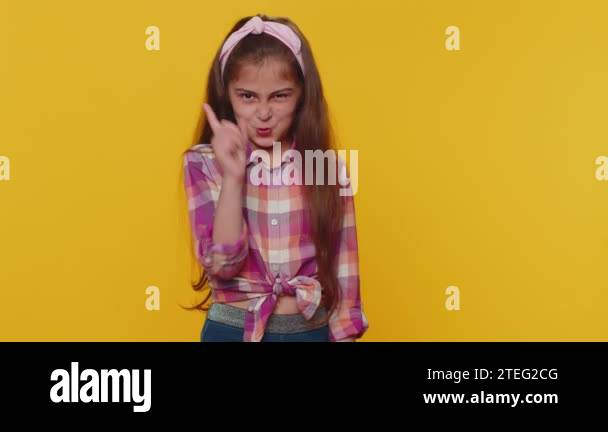Young preteen child girl kid shakes finger and saying no, be careful ...