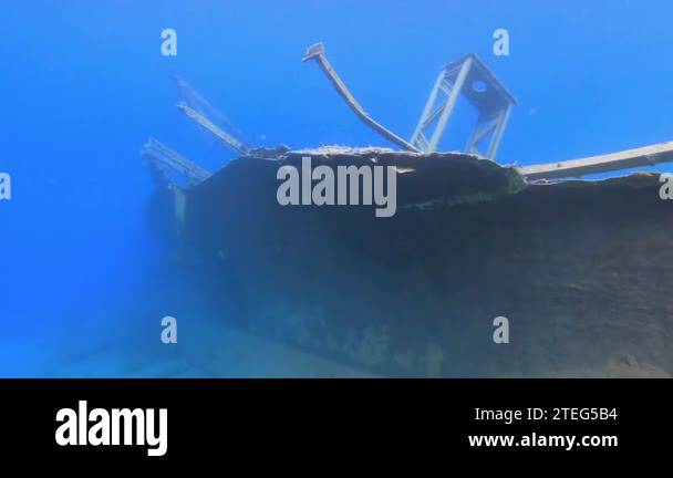 4K.Real old sunken ship wreck underwater at sea.Submerged boat in ocean ...
