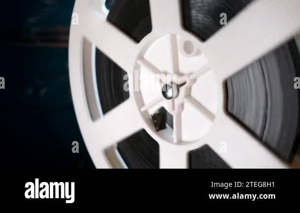 Footage of film reel turning. Analog player. Retro old-fashioned 8mm ...