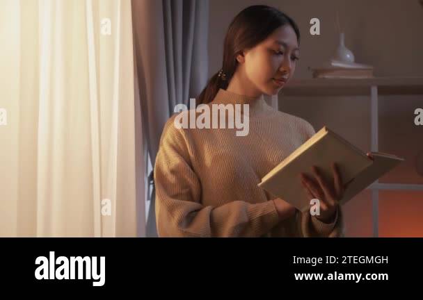 Home learning. Knowledge wisdom. Education hobby. Intelligent pensive girl enjoying reading open ...