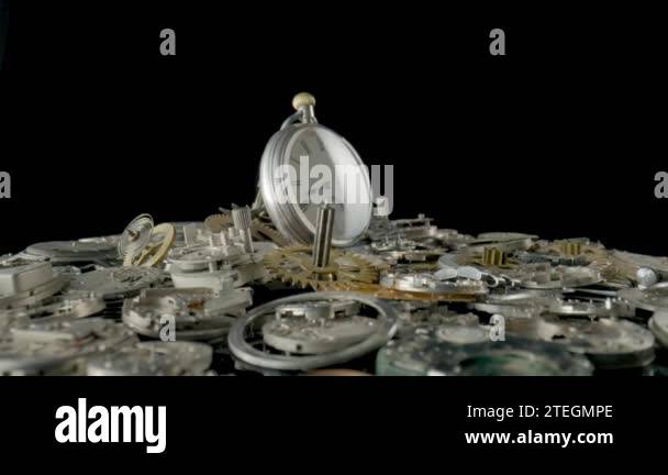 Silver vintage pocket watch dial on pile of clockwork parts. Round old ...