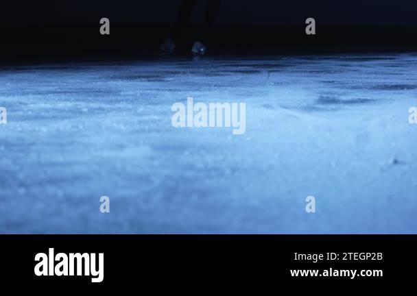 Detailed shot of womens legs in figure skating skates sliding on ice in ...