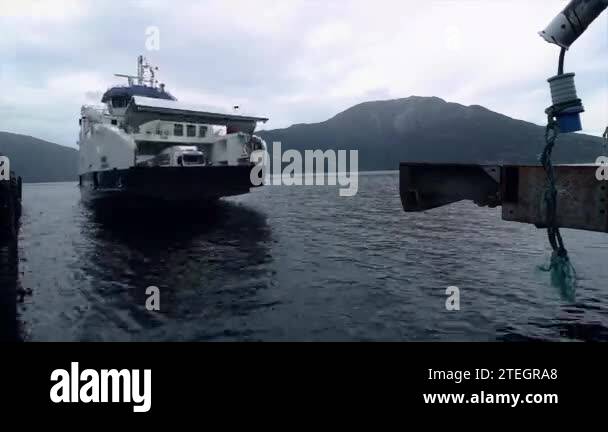 Norwegian ferry docking after crossing over a fjord in Norway in 4K ...