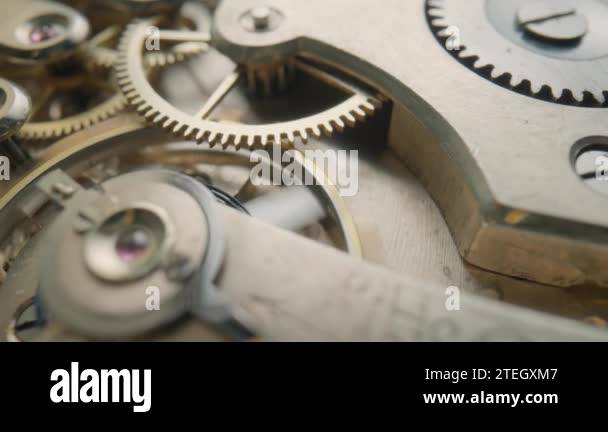 Moving metal gears inside working pocket watch mechanism. Working clock ...