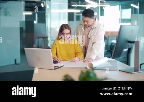 Crew multiracial team of creative people discussing a project. Mixed raced office engineers ...