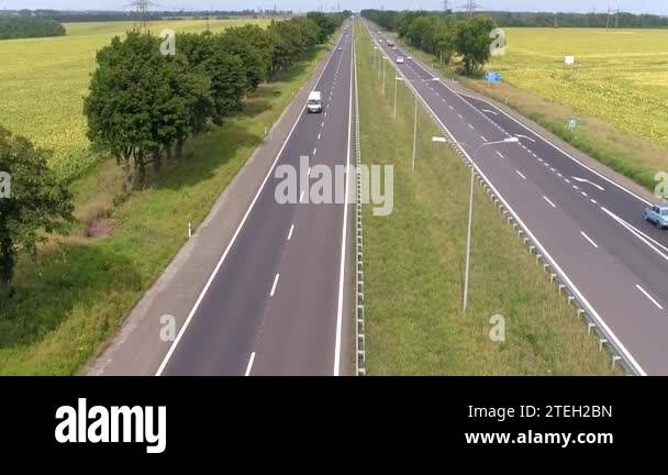 Cars driving along the road top view. Modern highway top view. Cars are ...