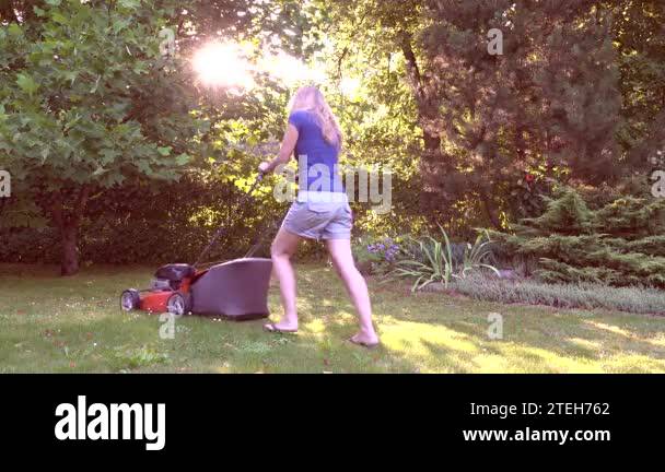 Woman mowing the grass Stock Videos & Footage - HD and 4K Video Clips ...