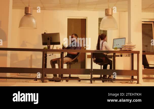 Business woman leaving company office during sunset hour, waving ...