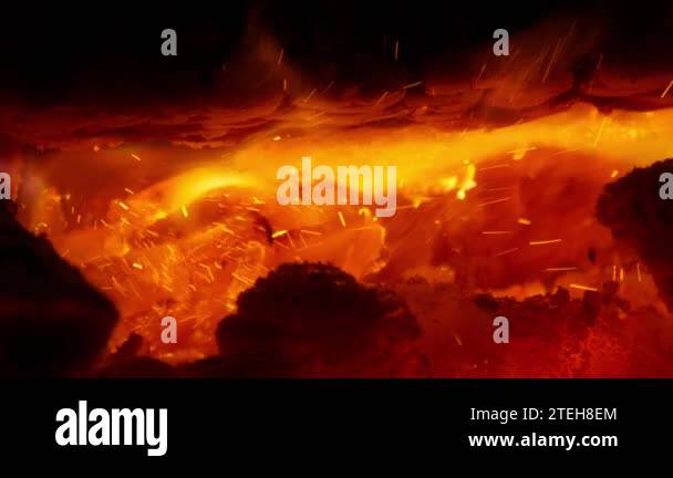 4K slow motion clip of bright orange red fire burning with sparks in ...