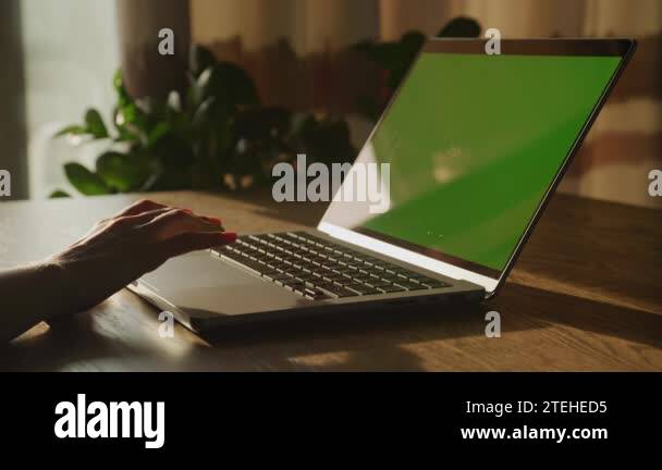 Close up of a caucasian woman hand scrolling on a laptop computer ...