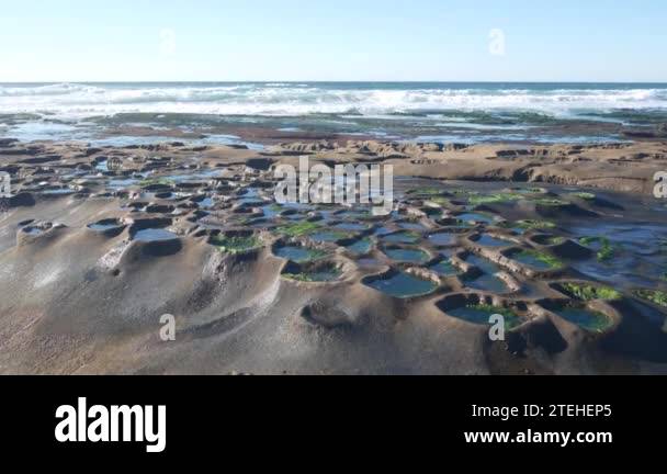 Eroded rock formation, tide pool in La Jolla, California coast, USA ...