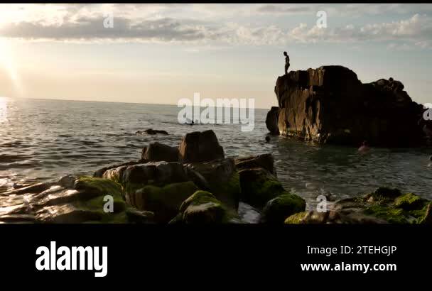 Men jumping from rock Stock Videos & Footage - HD and 4K Video Clips ...