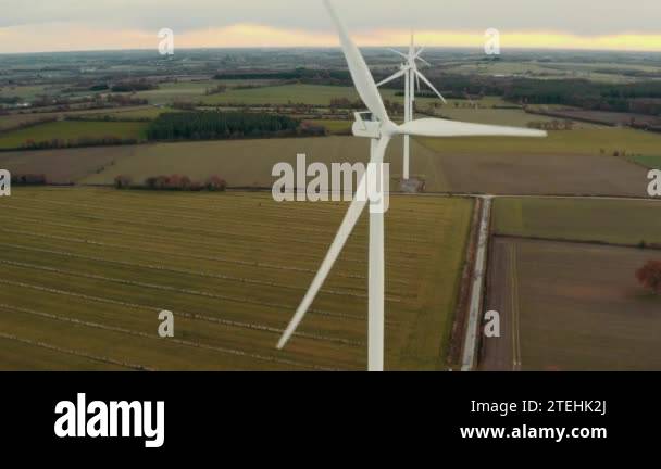Beautiful spin drone movement of wind farm white wind turbine spinning ...