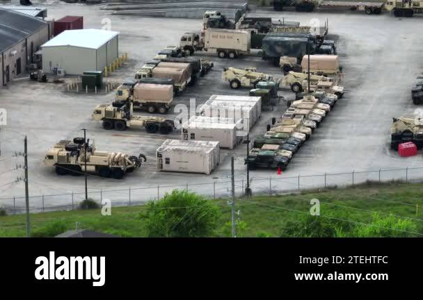 USA Army Depot with trucks and Humvee equipment storage ready for war ...