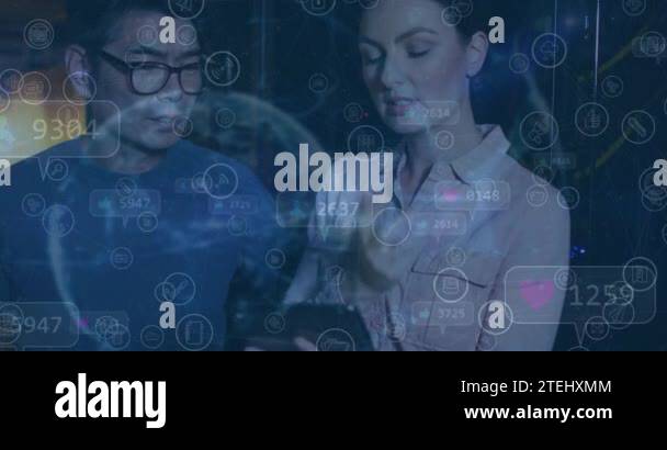 Animation of social media icons over diverse couple of server room workers. Cloud computing ...