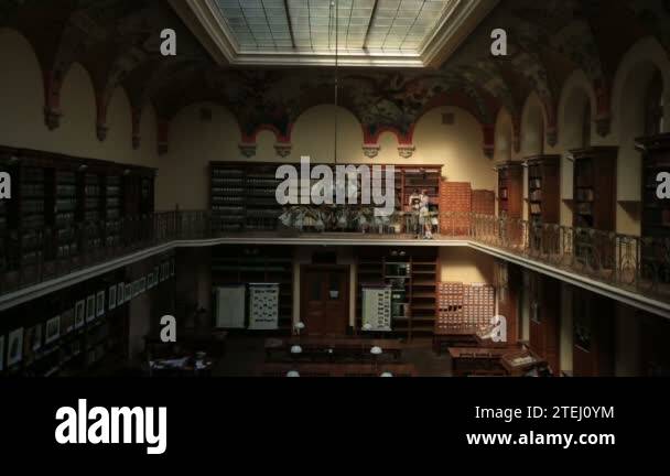 Romantic Young Couple Kissing On Cheeks In The Vintage Library While ...