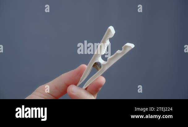 The hand shows how the clothespin works Stock Video Footage - Alamy