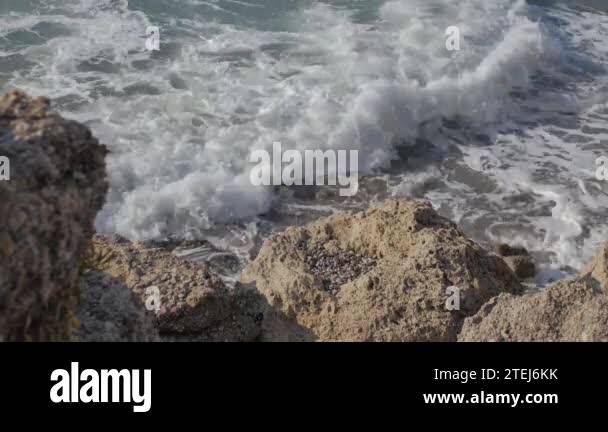 High angle of waves crushing on the west coastline of Rhodes Island, Greece. The framing ...