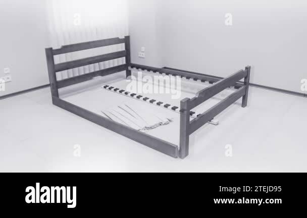 mounting of the frame of an orthopedic double wooden bed with a rigid ...