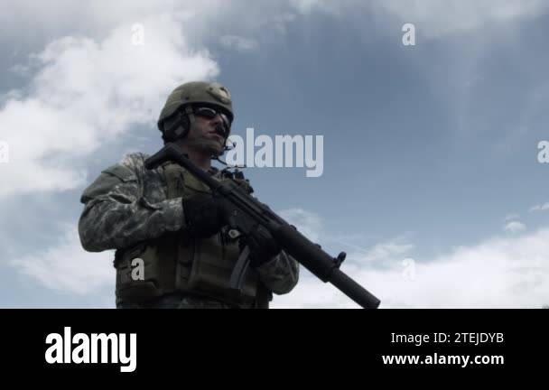 Soldier with weapon down, aiming, firing, lowering weapon. Green Beret ...