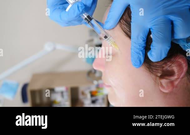 Cosmetologist doctor making multiple injections biorevitalization in ...