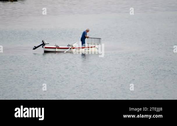 Fisherman with his catch of fish in traditional fishing boat Stock ...