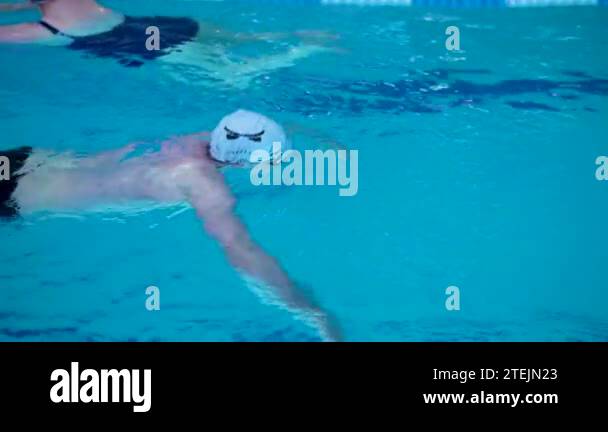 Professional swimmer in a sports pool healthy lifestyle concept ...