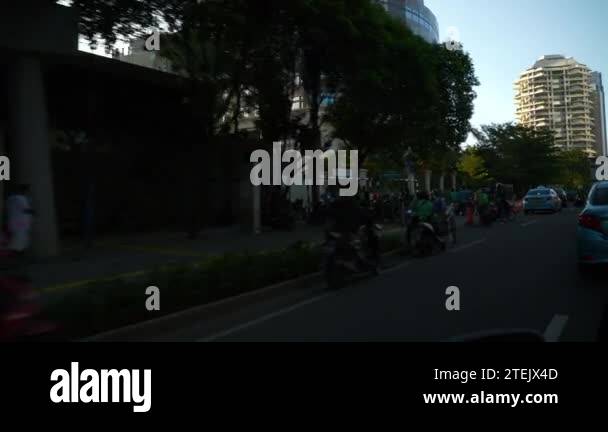 JAKARTA, INDONESIA - CIRCA 2020: Sunny day Jakarta city busy traffic street road junction, 4k ...