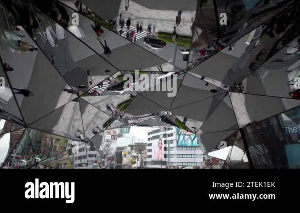 Tokyo, Japan-04 February, 2020: People reflections in the mirror of ...