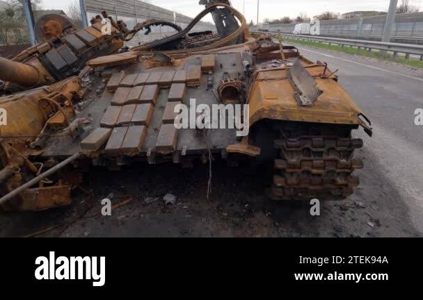 Kyiv region, Ukraine - April 27, 2022: Burned rusty Russian battle tank ...