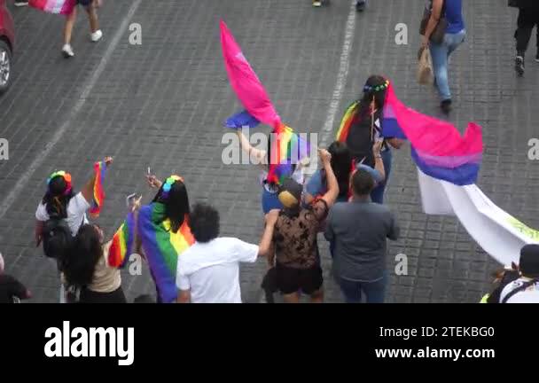 An aerial view of People with rainbow flags in the annual Pride Parade ...