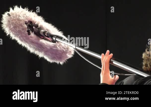 Boom operator holding microphone Stock Videos & Footage - HD and 4K ...