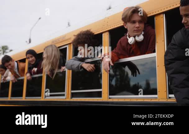 Students with heads out of school bus windows Stock Video Footage - Alamy