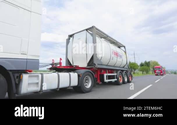 Shooting truck wheels close-up. The truck is moving on the highway ...