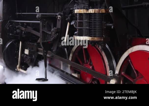 Old wheels and parts of a steam engine close-up. Soviet locomotive ...