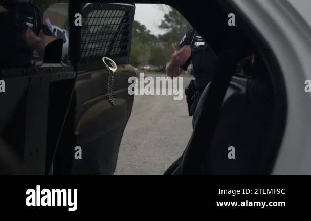 Police officer arrests a drunk driver who failed a DUI test during a ...