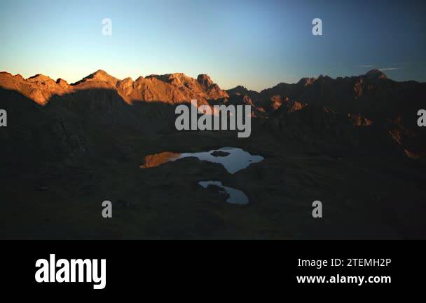 8K 7680x4320.Morning sunrise lights reflected in rocky peaks.High ...