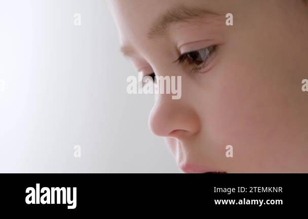 Face of little 5 year baby boy extremely close-up. Side view. Child ...