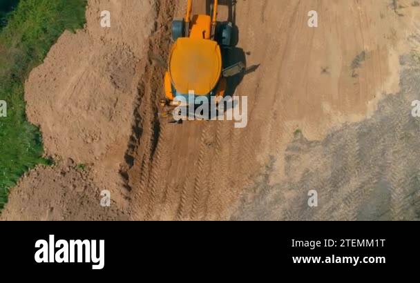 The bulldozer levels the floor plane for future work. The bulldozer ...