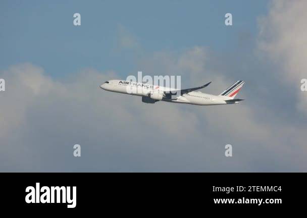 Air France plane flying high above the clouds after taking off from ...