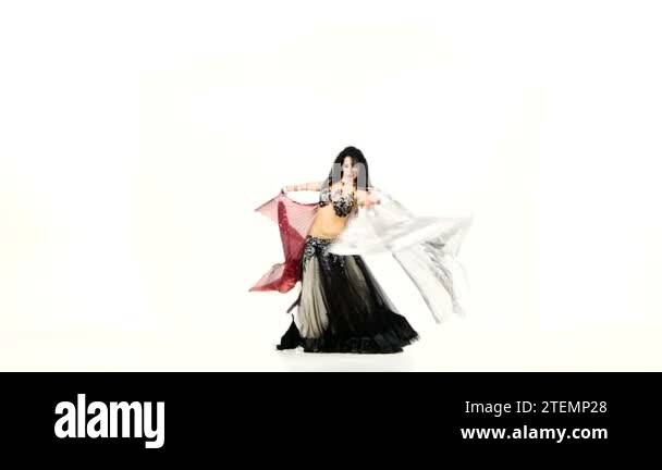Beautiful exotic belly dancer woman with two wings and shaking her hips ...