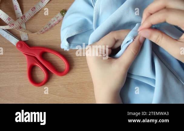 Repairing clothing Stock Videos & Footage - HD and 4K Video Clips - Alamy