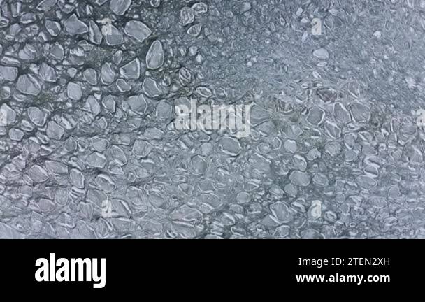 Winter day frozen sea top view on sea water ice texture. The sea froze ...