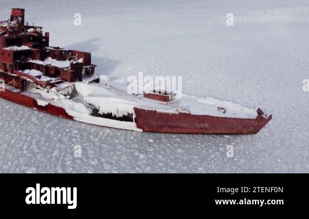 A cargo ship was thrown ashore during a sea storm. In winter, a large ...