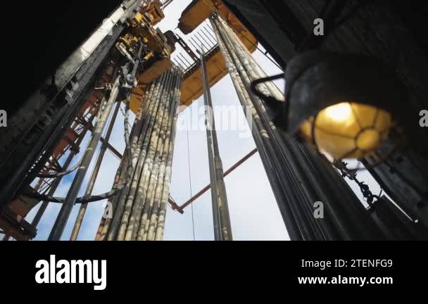Top Drive System TDS and Derrick of Oil Drilling Rig. Oil and Gas ...