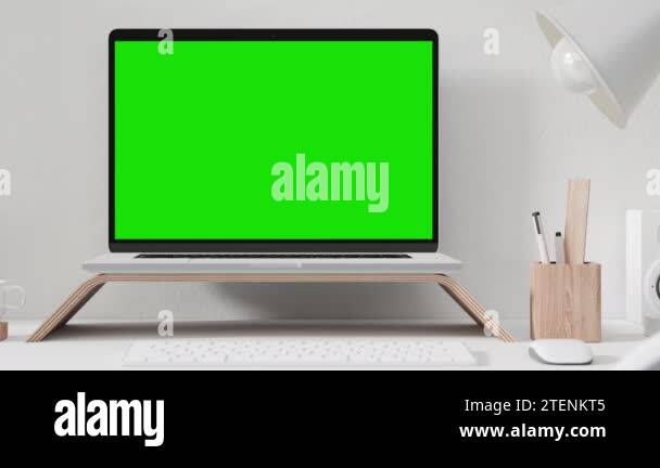 Computer notebook mockup with greenscreen on working desktop Stock ...